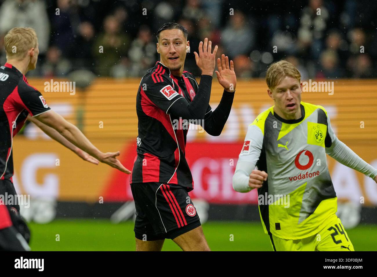 Frankfurt's Younes Ebnoutalib, centre, reacts during the Bundesliga ...