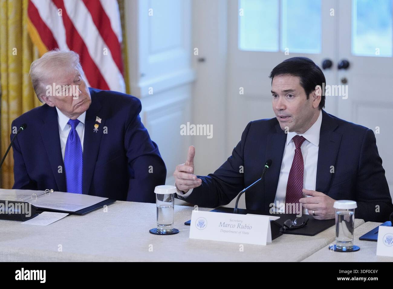President Donald Trump listens to Sec. of State Marco Rubio speak ...