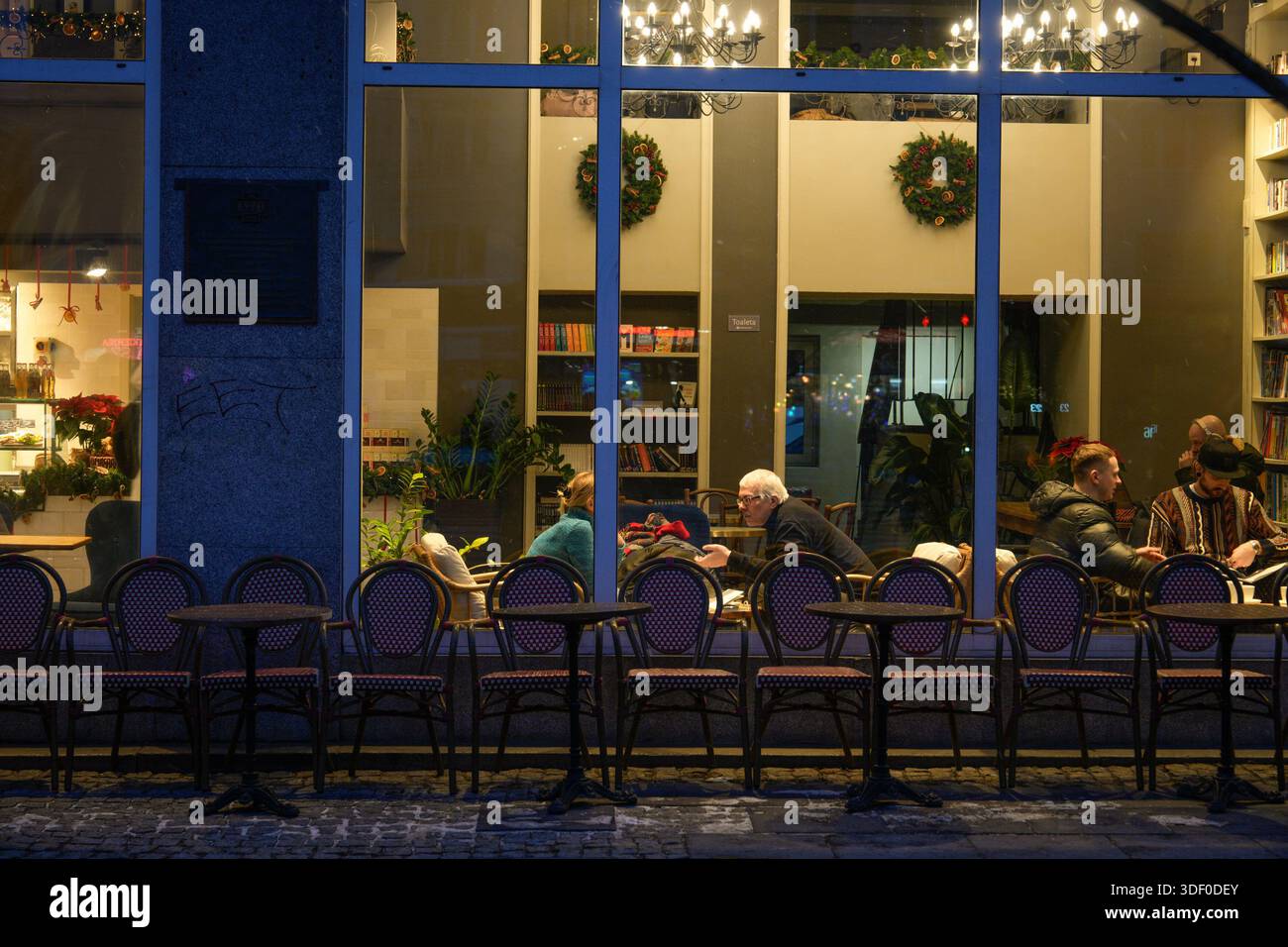 Empty chairs and tables are seen outside a Vincent cafe coffee shop in ...