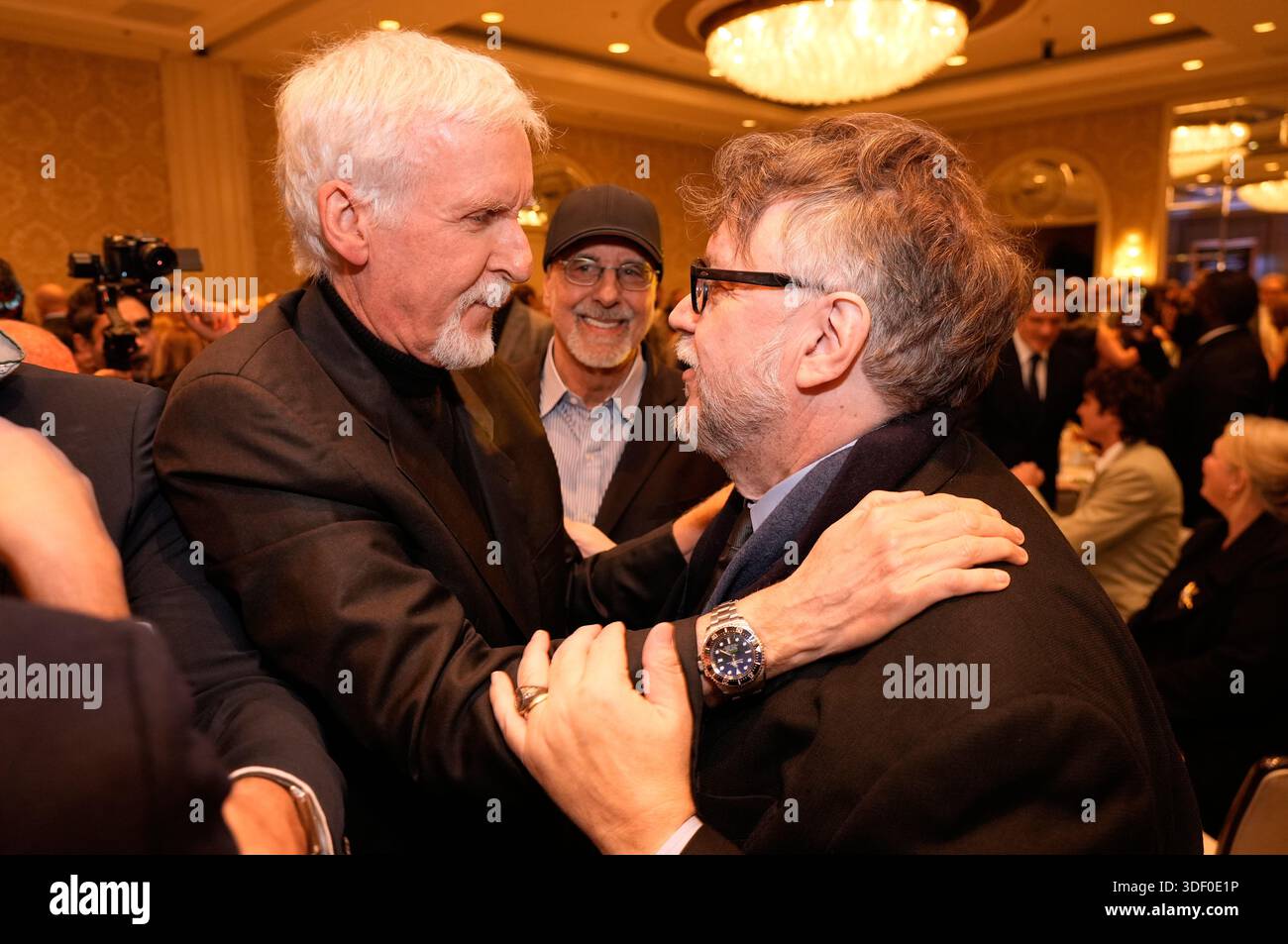 Filmmakers James Cameron, left, and Guillermo del Toro greet each other ...
