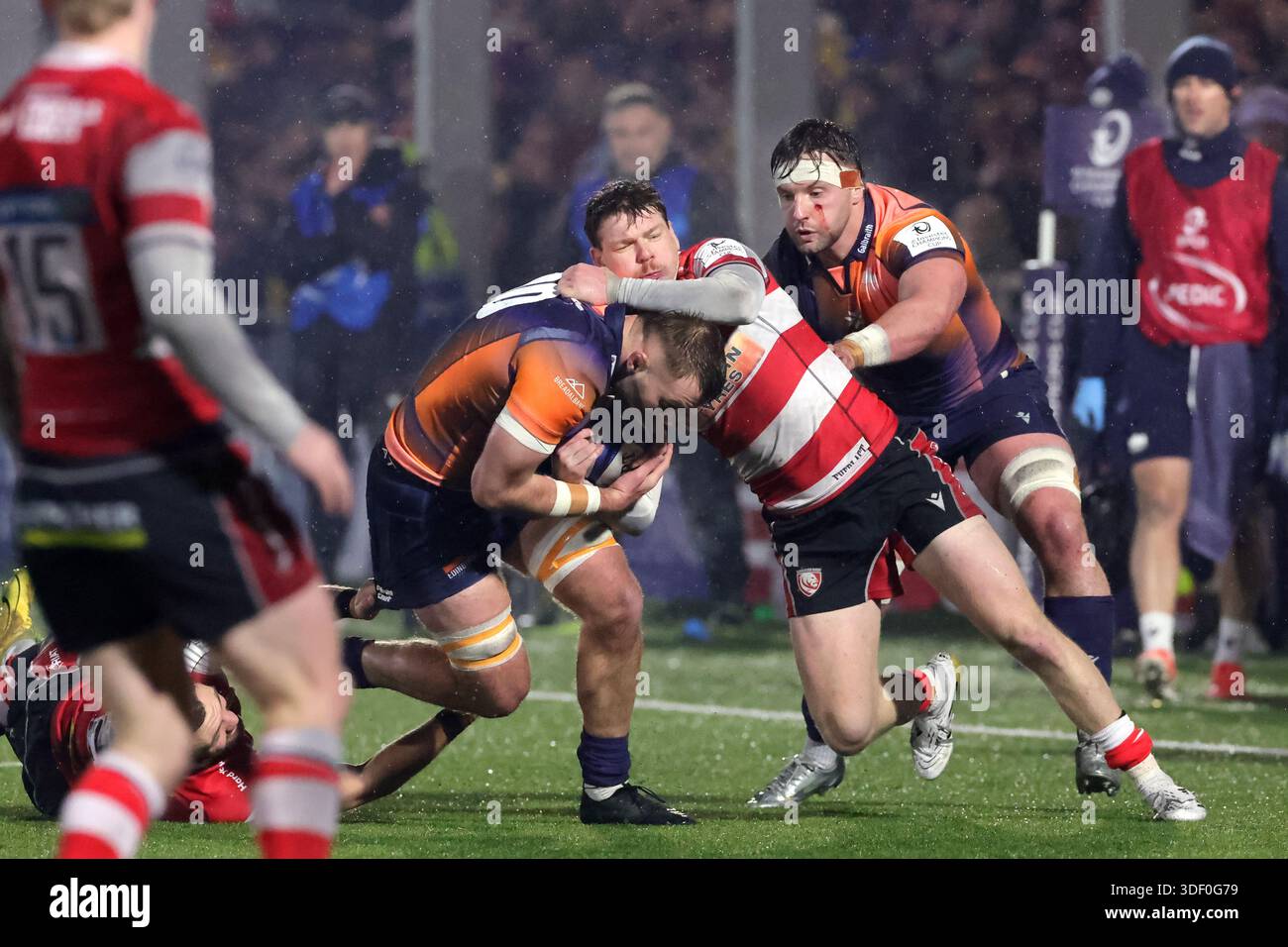 Edinburgh's Tom Dodd is tackled by Gloucester's Mike Austin during the ...