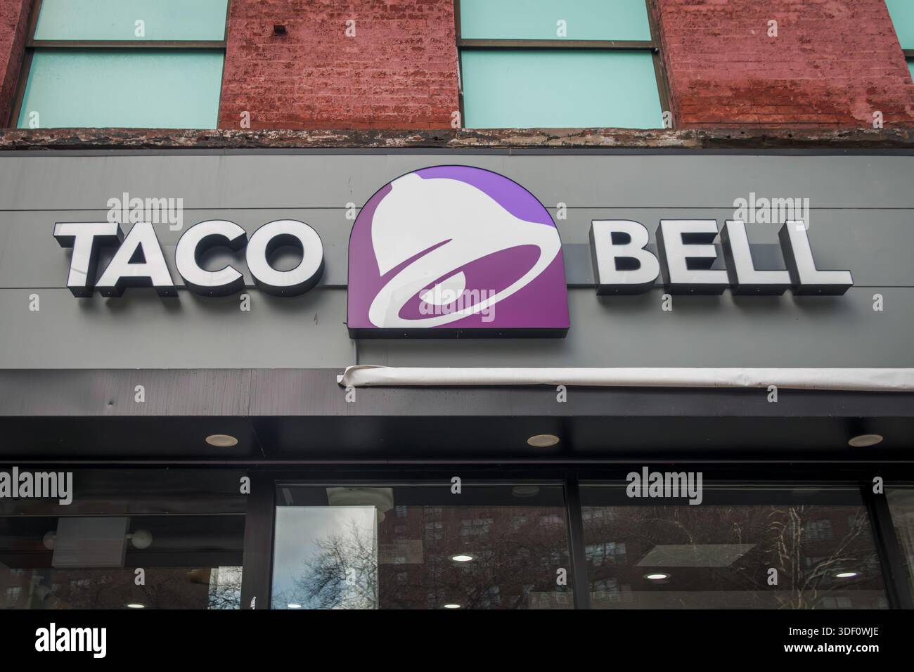 Sign at the entrance to a Taco Bell store in Manhattan. (Photo by Erik ...