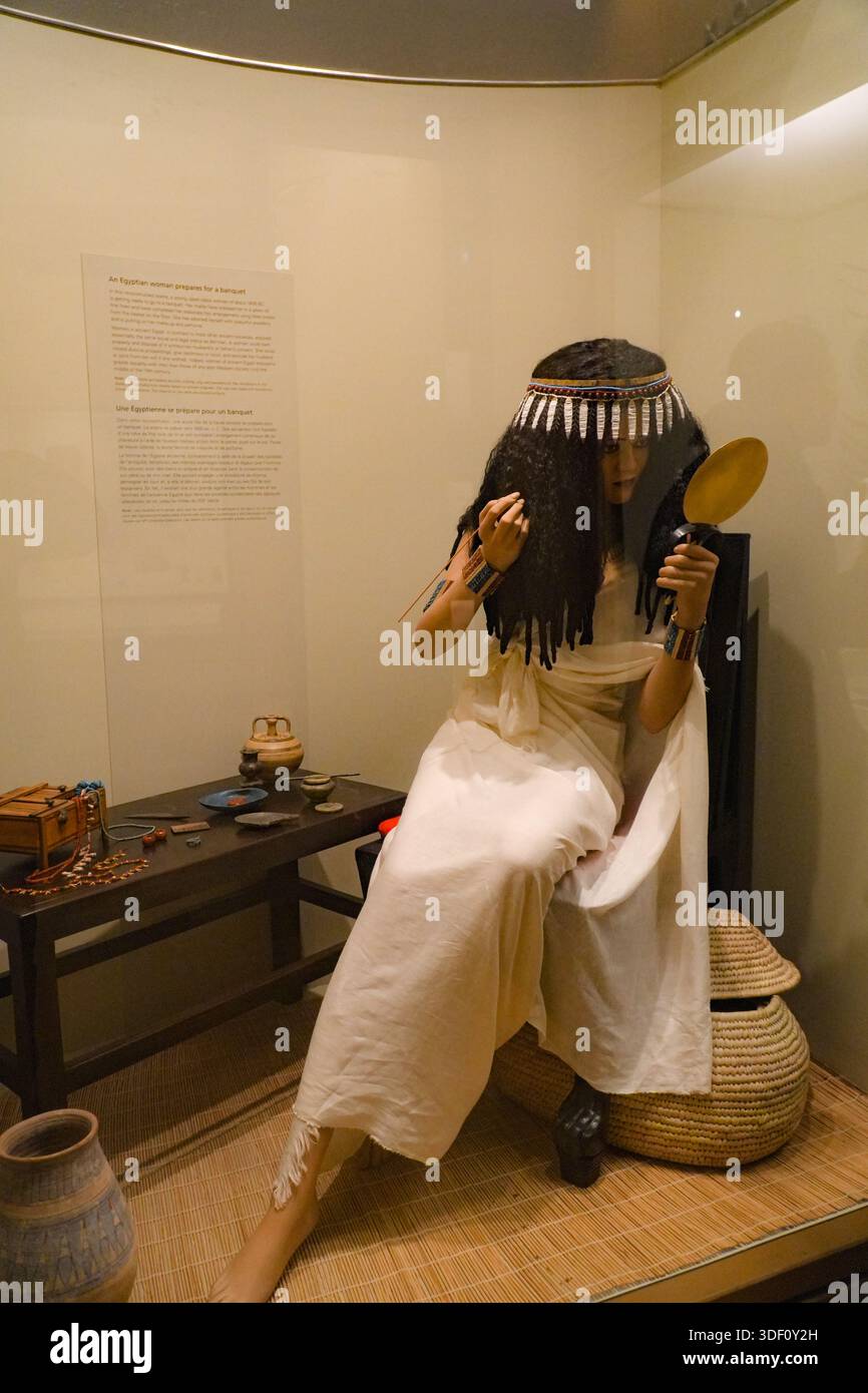 Ancient Egyptian woman preparing for banquet exhibit. Historical ...