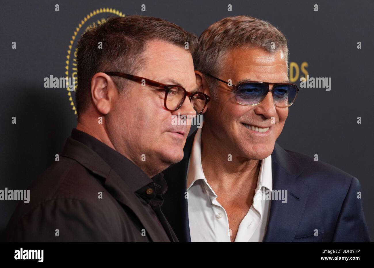 Nick Offerman, left, and George Clooney pose together at the AFI Awards ...
