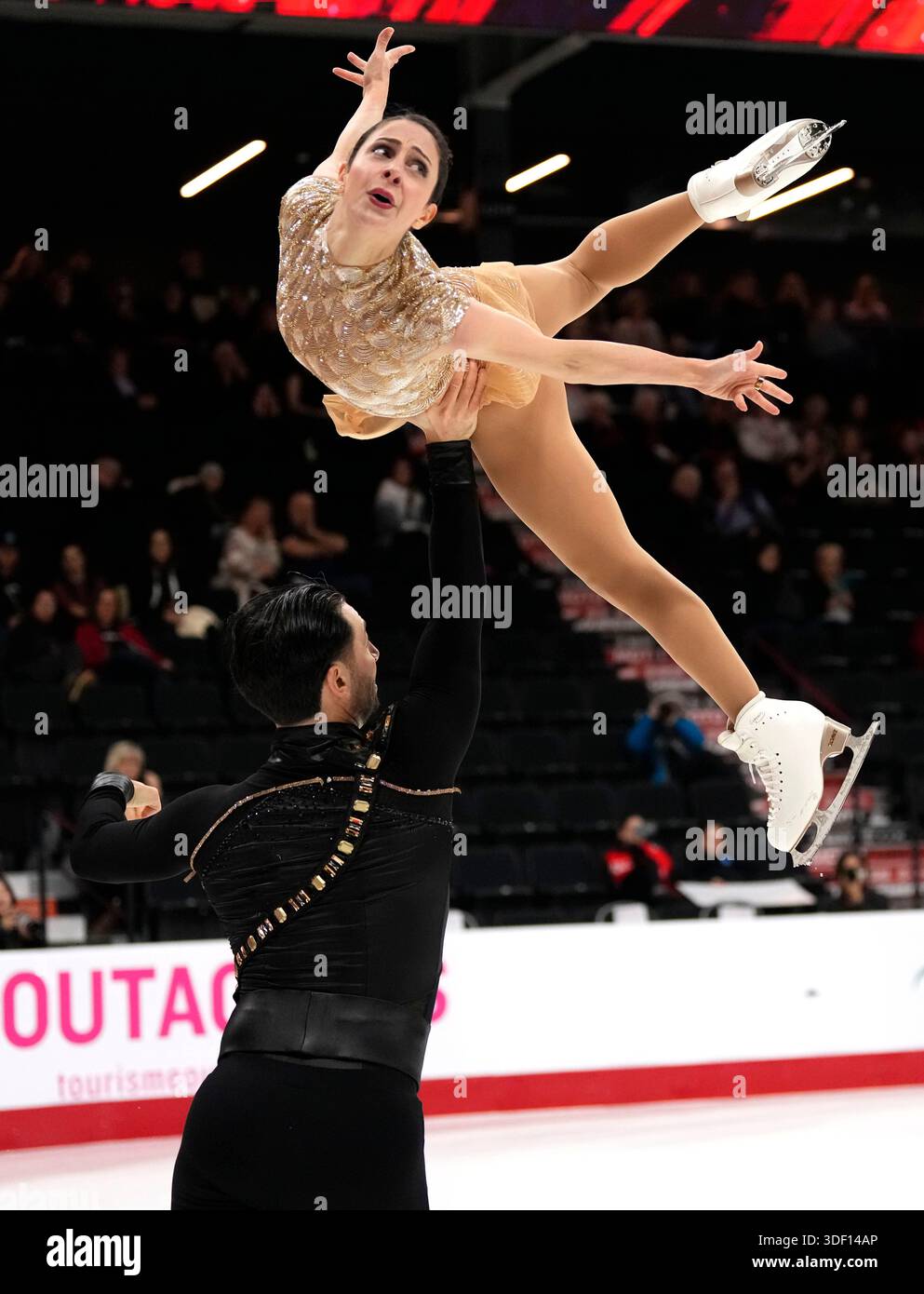 Deanna Stellato, top, and Maxime Deschamps, bottom, perform their short ...