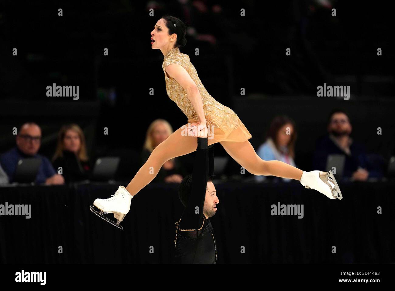 Deanna Stellato, top, and Maxime Deschamps, bottom, perform their short ...