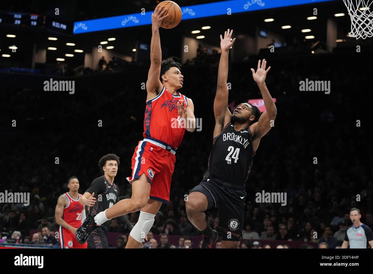 LA Clippers' Kobe Sanders (4) shoots over Brooklyn Nets' Cam Thomas (24 ...