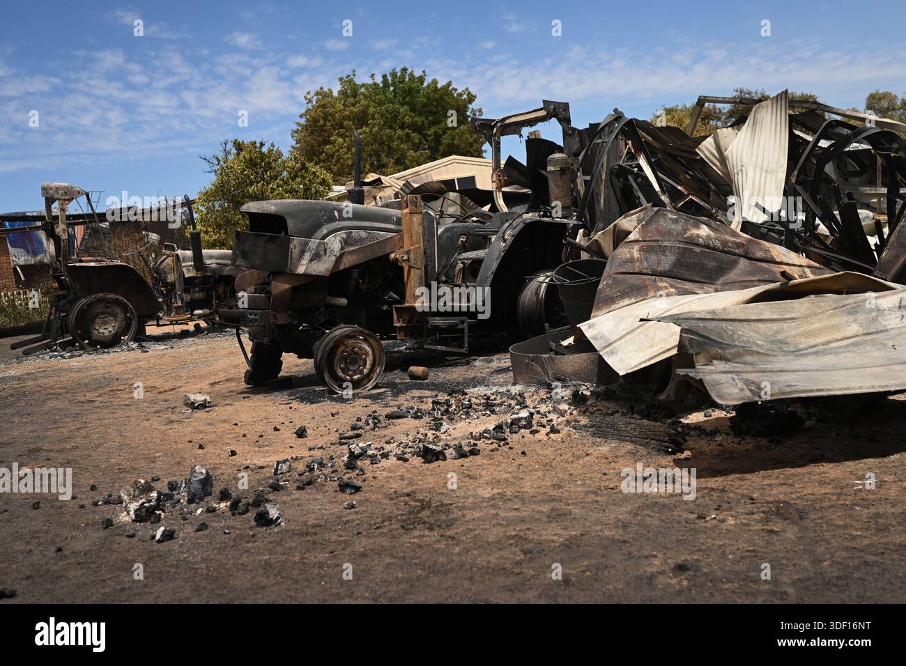 Destroyed tractors and sheds at a property in Harcourt, Victoria ...