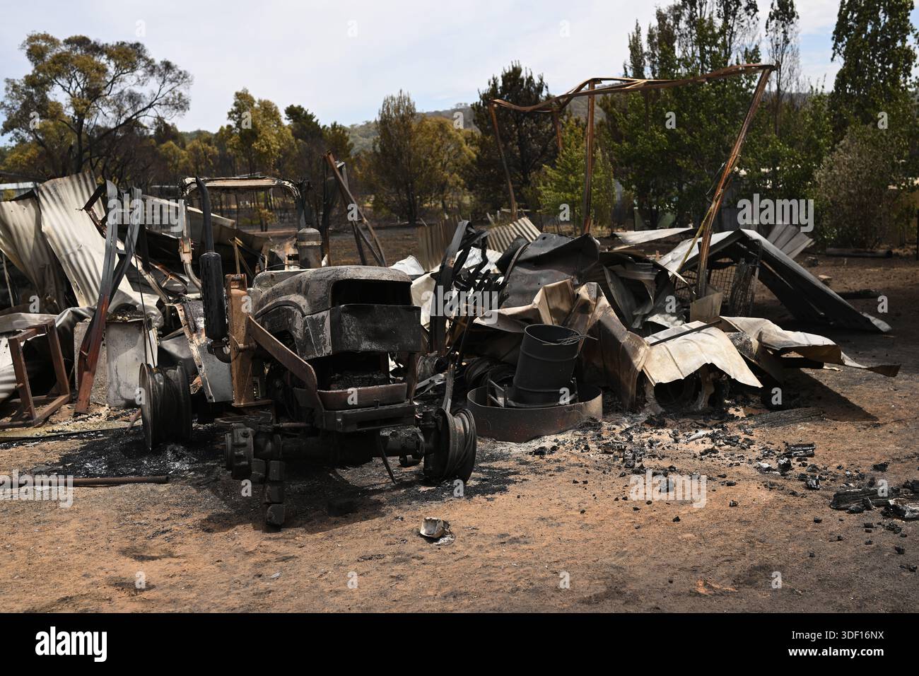 Destroyed tractors and sheds at a property in Harcourt, Victoria ...
