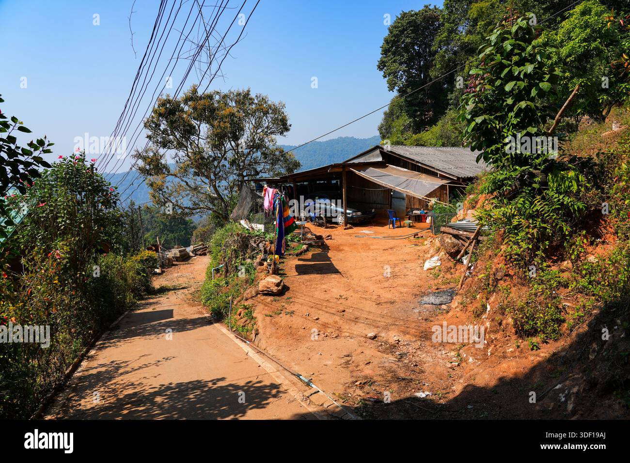 Downhill street with traditional houses in the Hmong Doi Pui Village ...