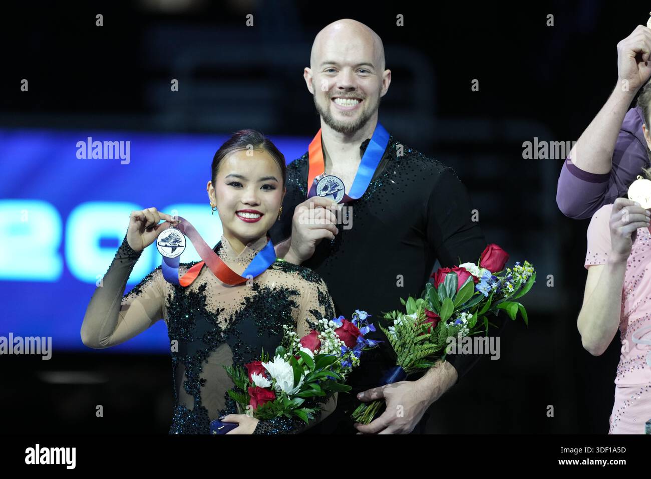 Silver medalists Ellie Kam and Danny O'Shea hold up their medals after ...