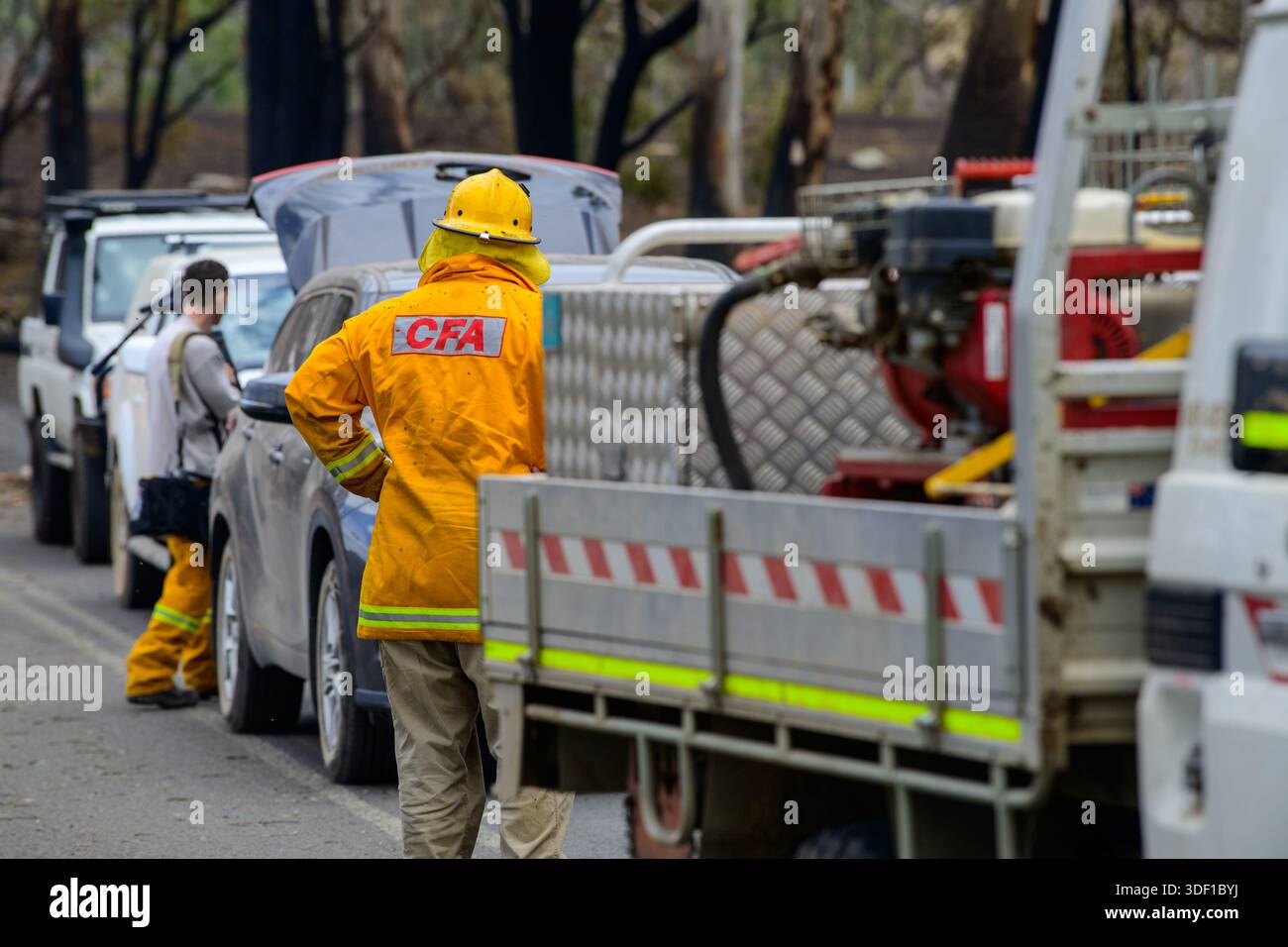 Ruffy, Australia. 10th Jan, 2026. A CFA member waits for the road to be ...