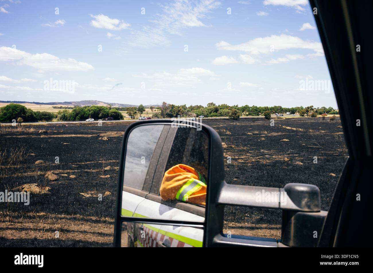 CFA firefighters work to contain a highway-side grassfire near the ...