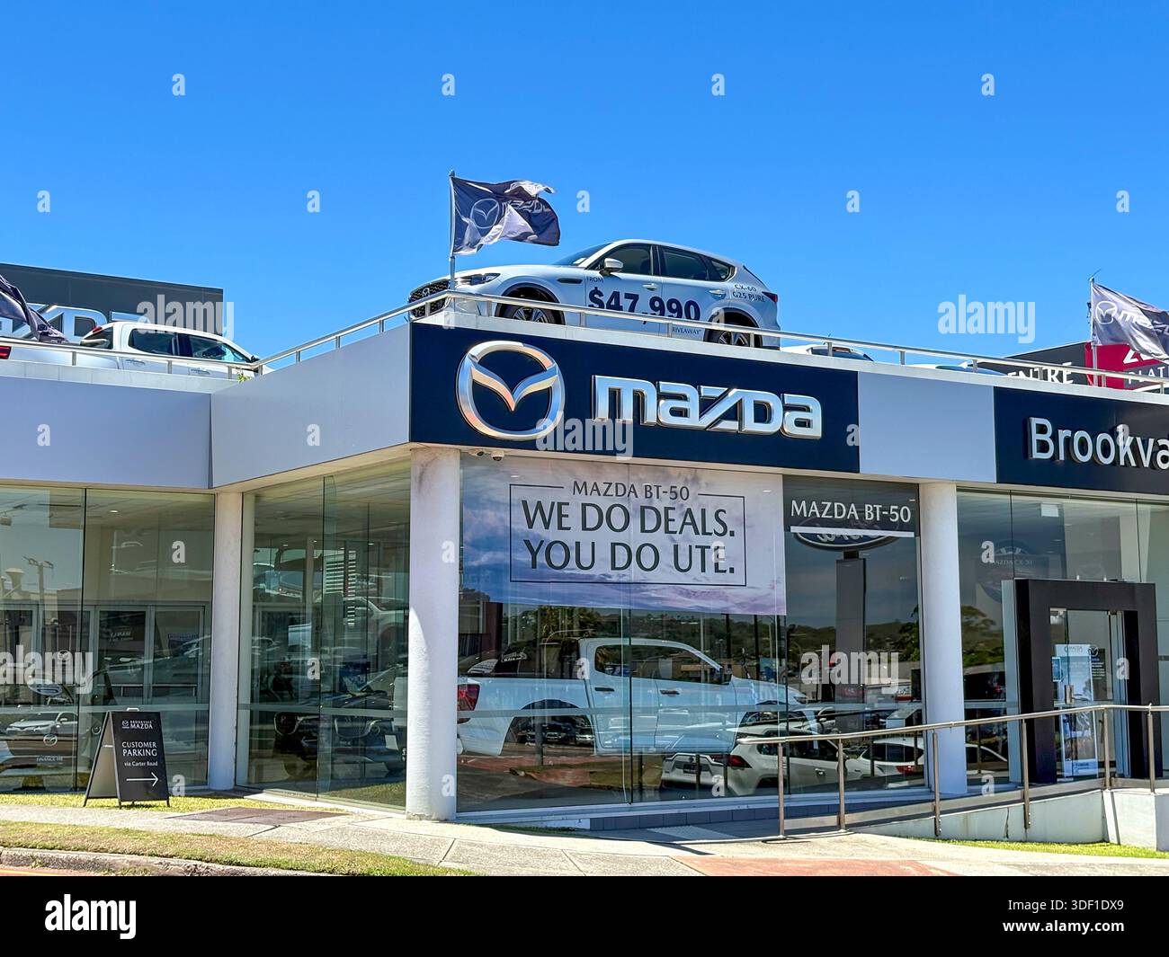 Mazda showroom car vehicle dealership promoting the Mazda ute vehicle ...
