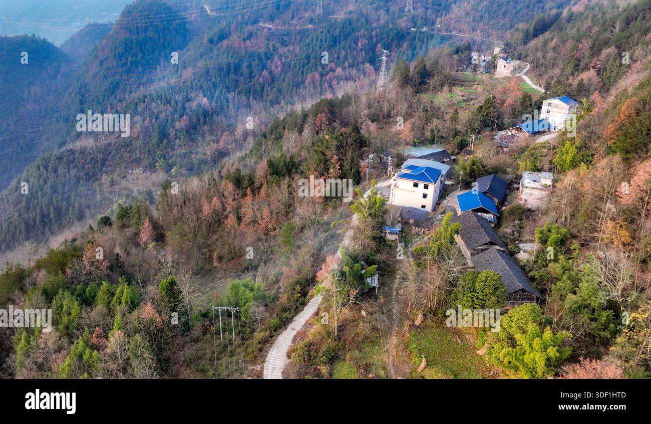 The morning sun rises over mountains as mist lingers in Dingshi Town ...
