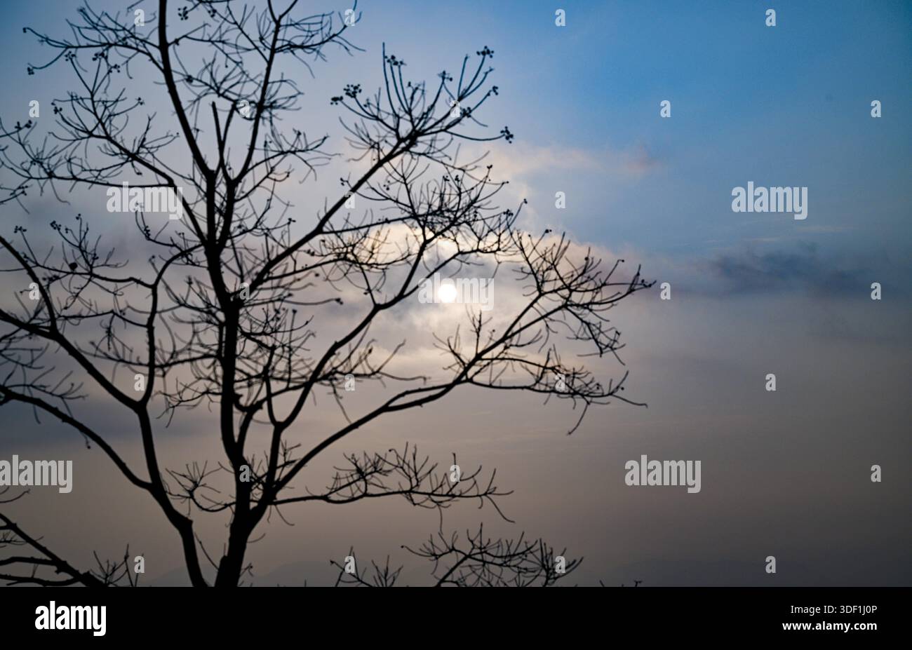 The morning sun rises over mountains as mist lingers in Dingshi Town ...