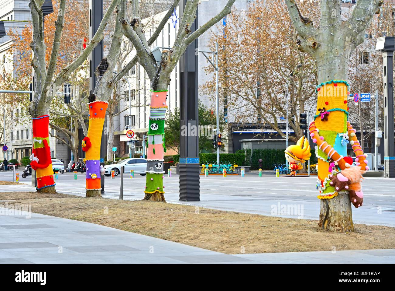 Trees are decorated with colorful sweaters in Beijing, China, 7 January ...