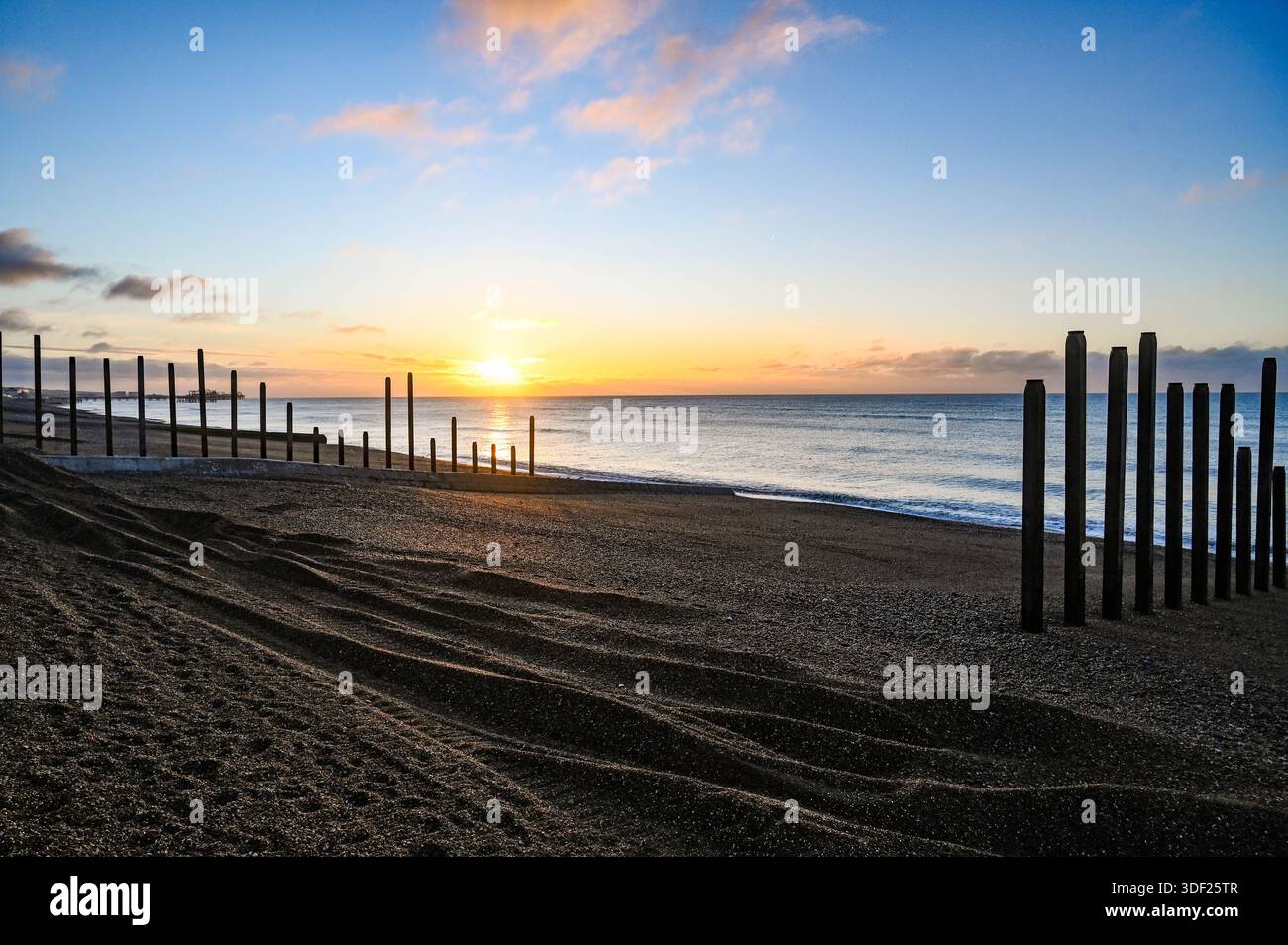 Brighton UK 10th January 2026 - New timber groynes are being put up on ...