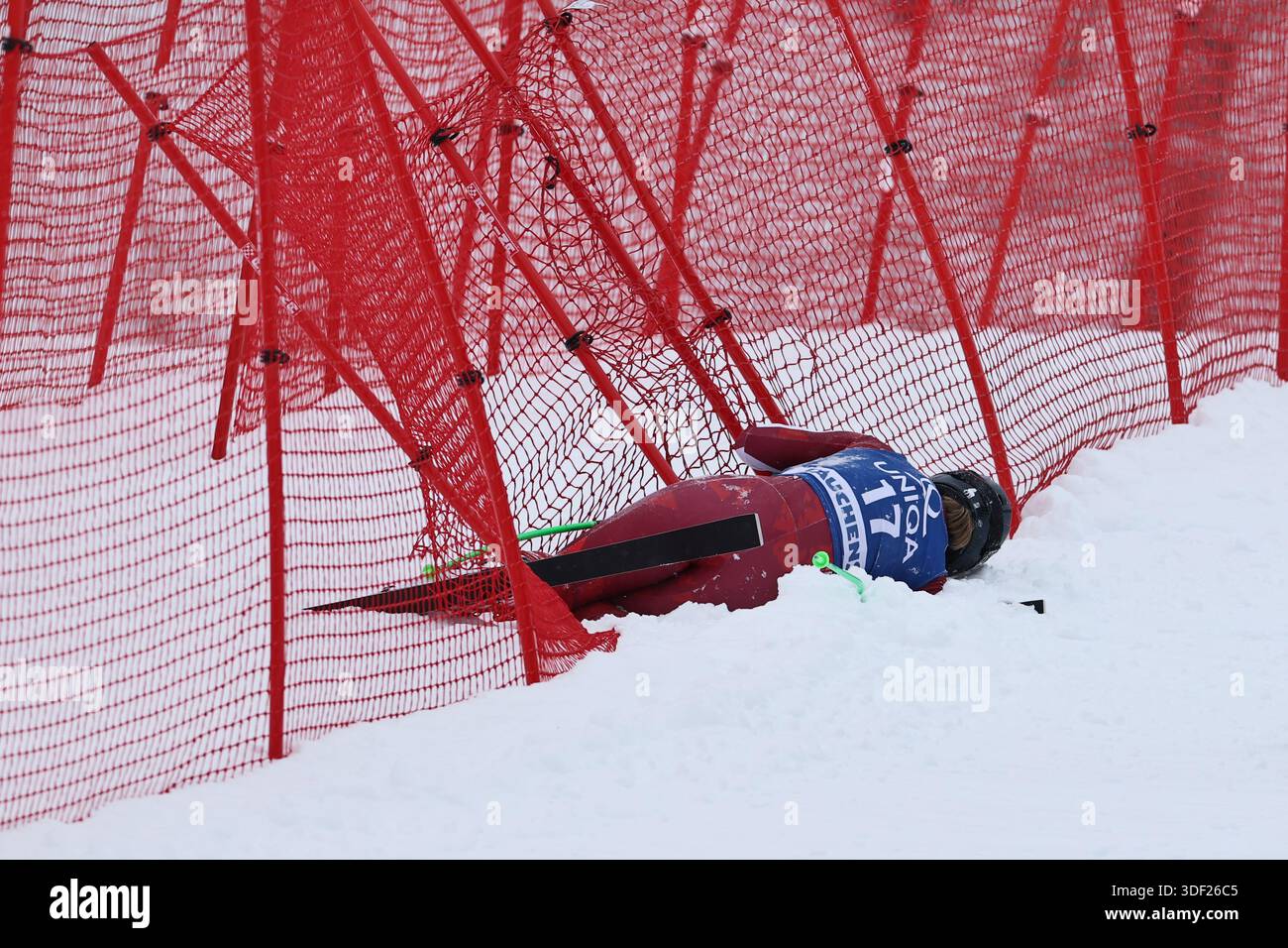 Austria's Magdalena Egger lies on the snow after crashing during an ...