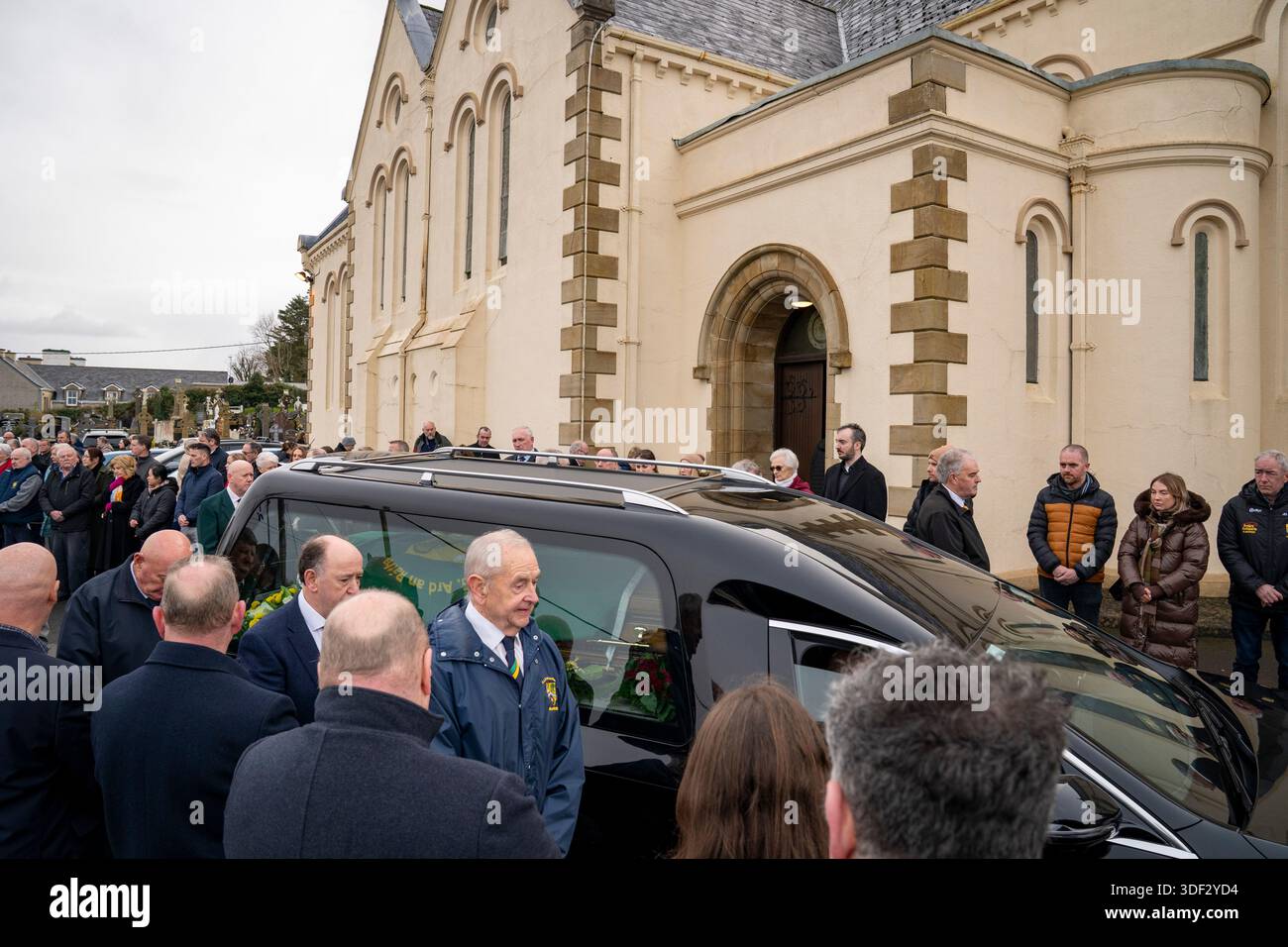 The coffin of Stephen McCahill arrives at the Church Of The Holy Family ...