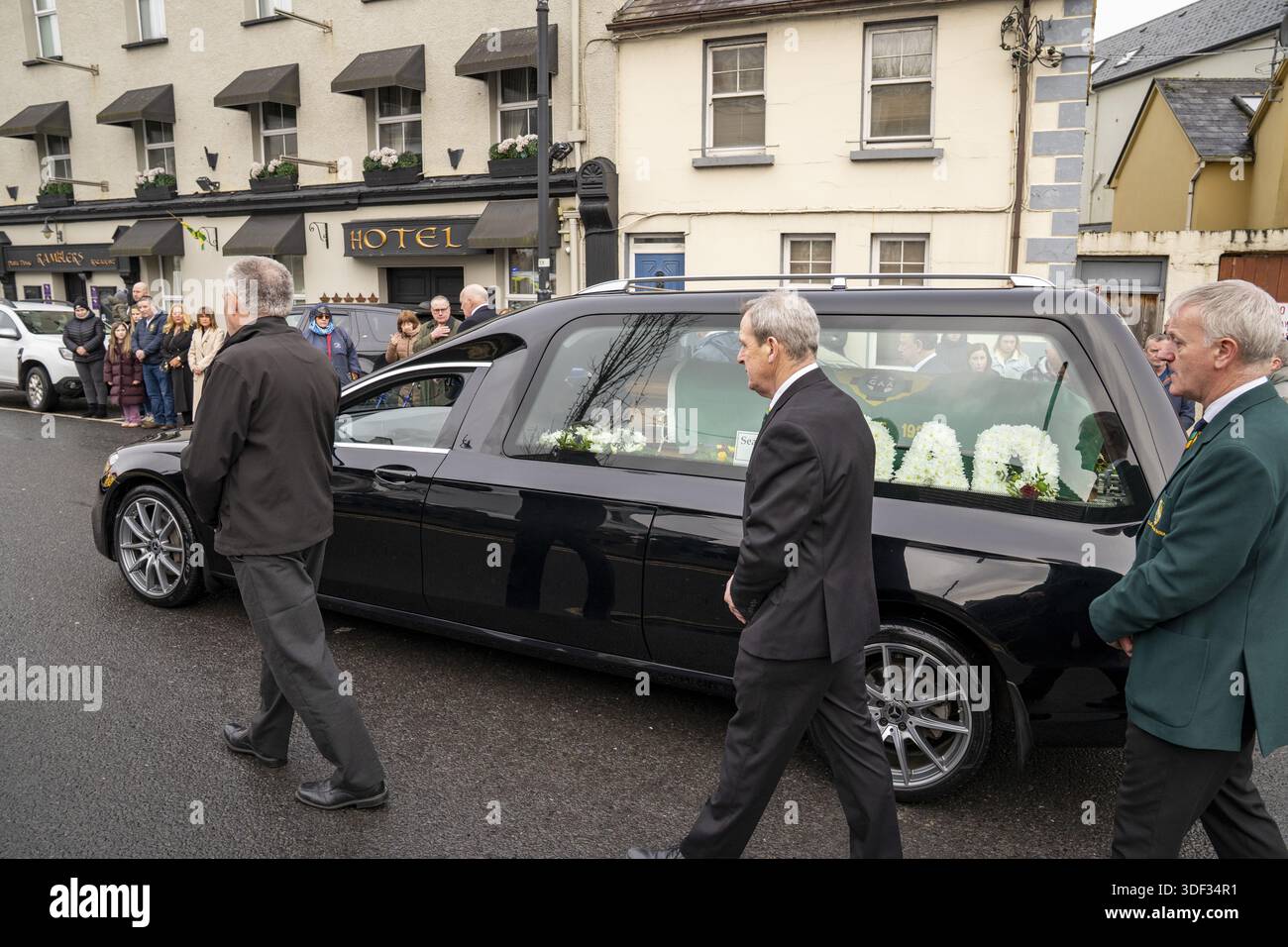 The coffin of Stephen McCahill arrives at the Church Of The Holy Family ...