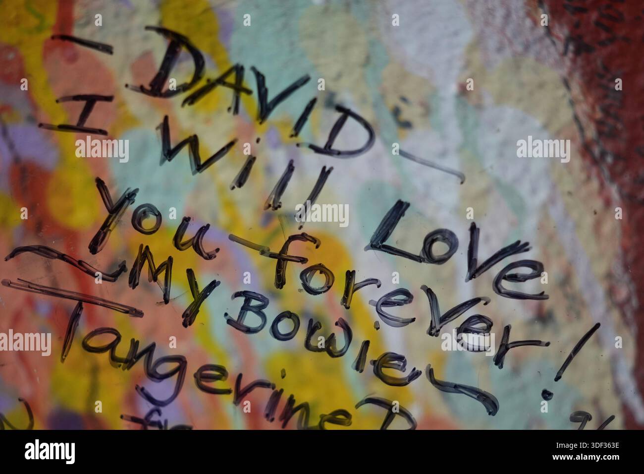 A message on a protected mural of David Bowie, on the 10th anniversary ...
