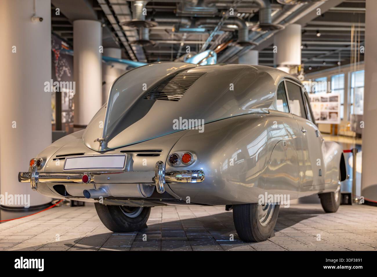 Classic aerodynamic car on display, reflecting transport history and ...