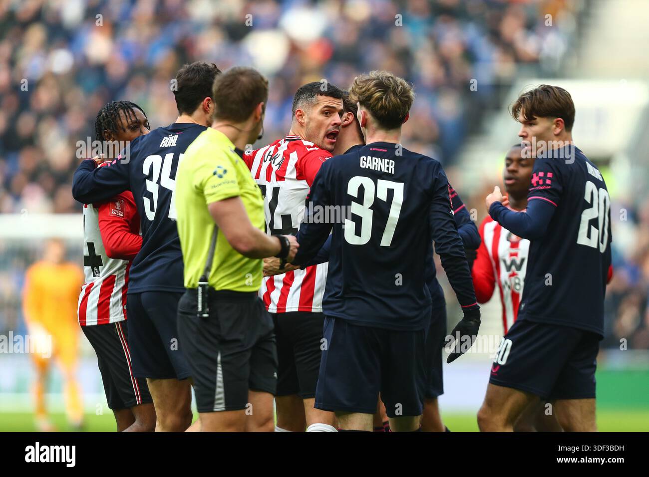 Granit Xhaka of Sunderland separates Romaine Mundle of Sunderland and ...