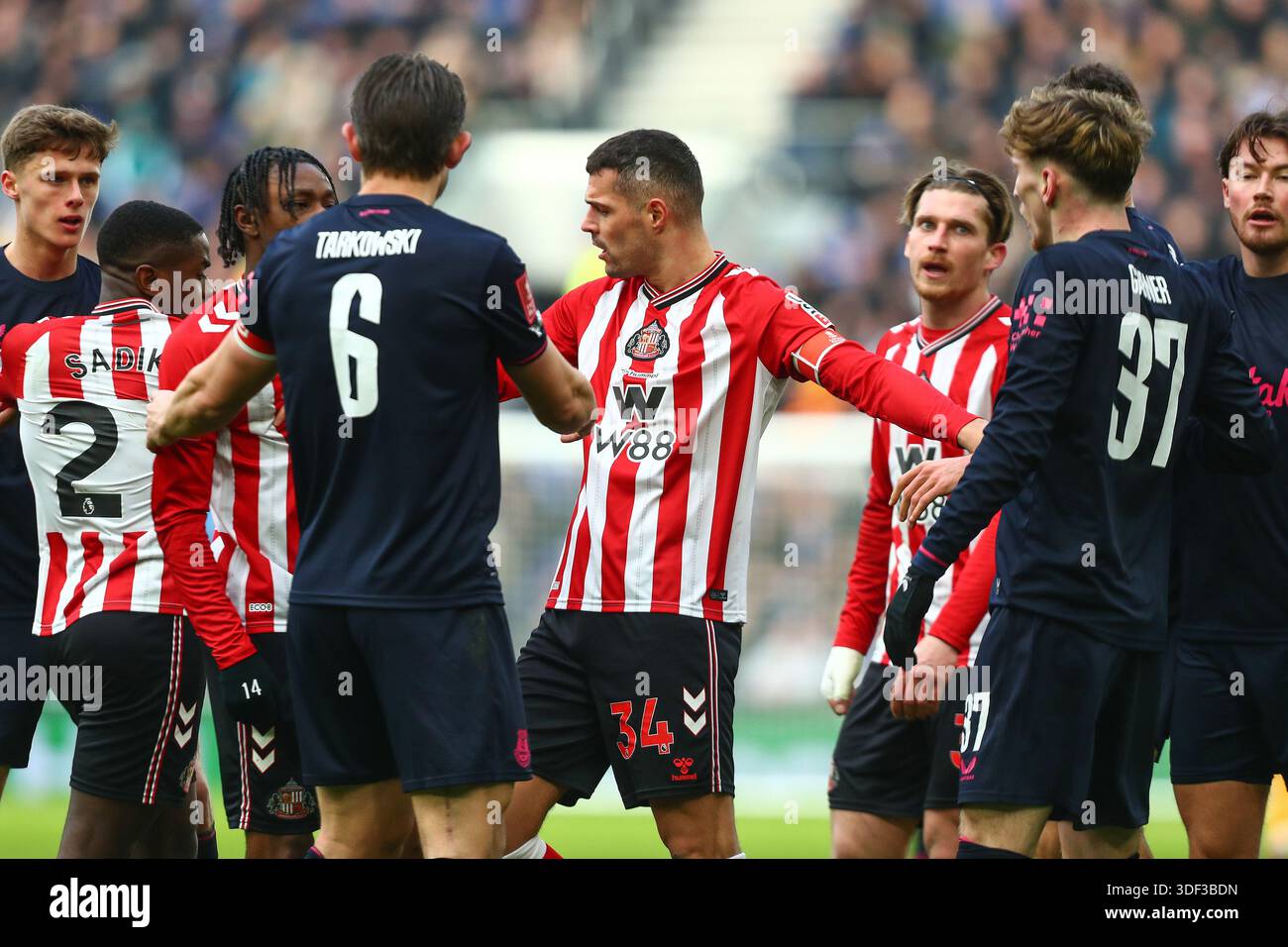 Granit Xhaka of Sunderland separates Romaine Mundle of Sunderland and ...