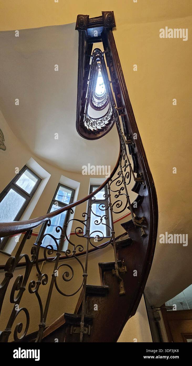 A classic spiral staircase featuring traditional craftsmanship, curved ...