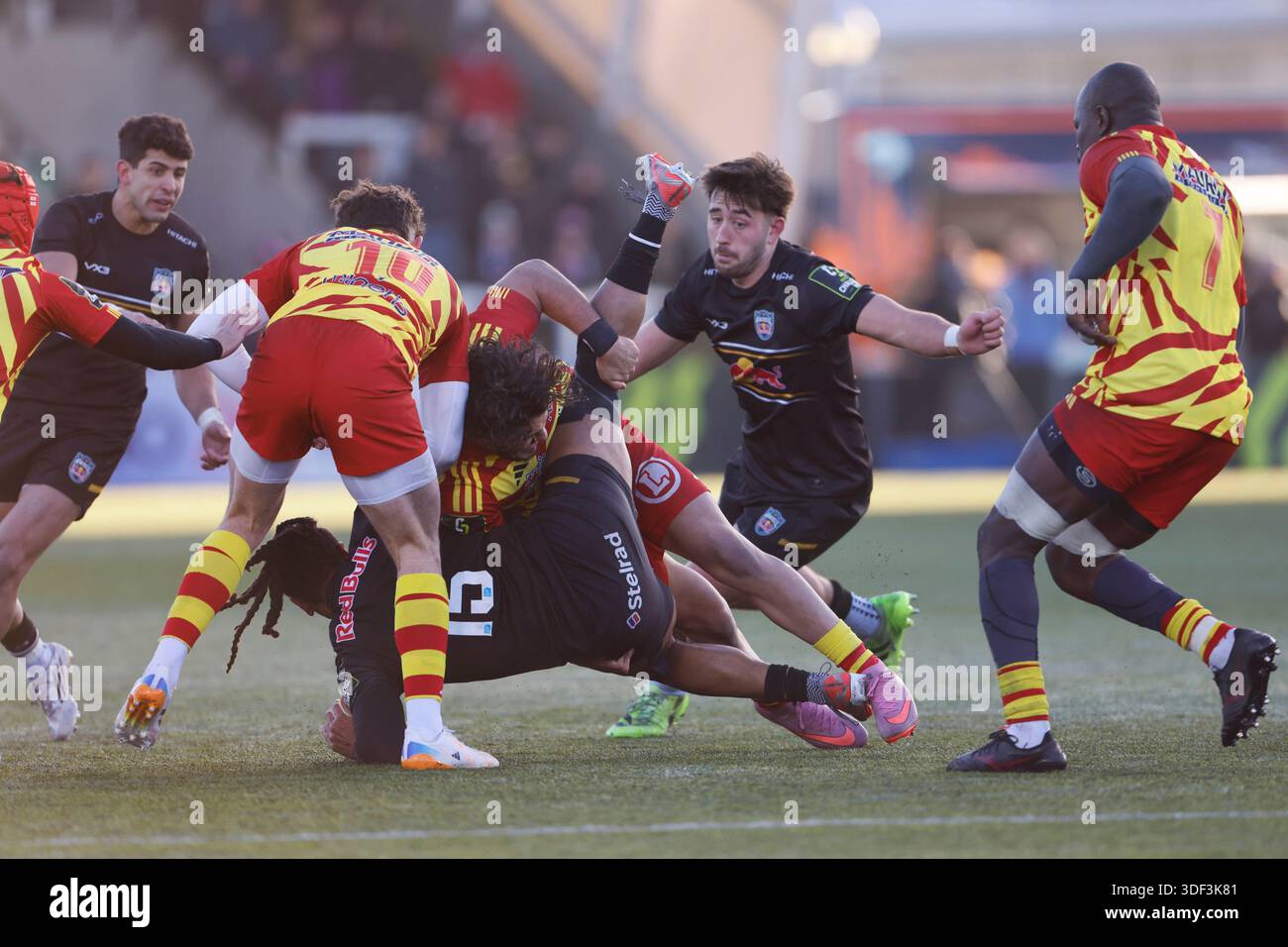 Newcastle Red Bulls' Elliott Obatoyinbo (centre) is tackled during the ...