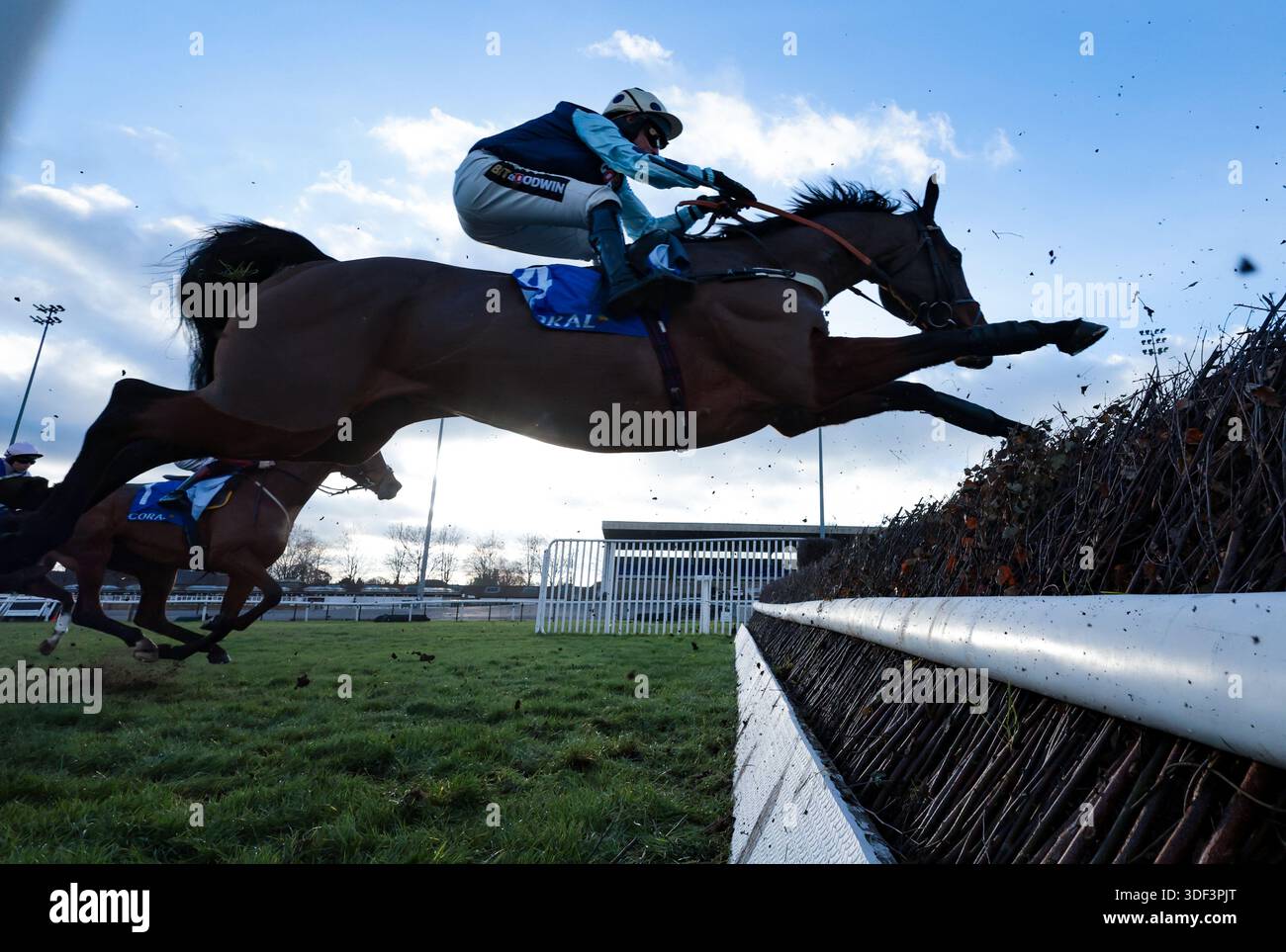 Edwardstone ridden by Tom Cannon clears a fence on their way to winning ...