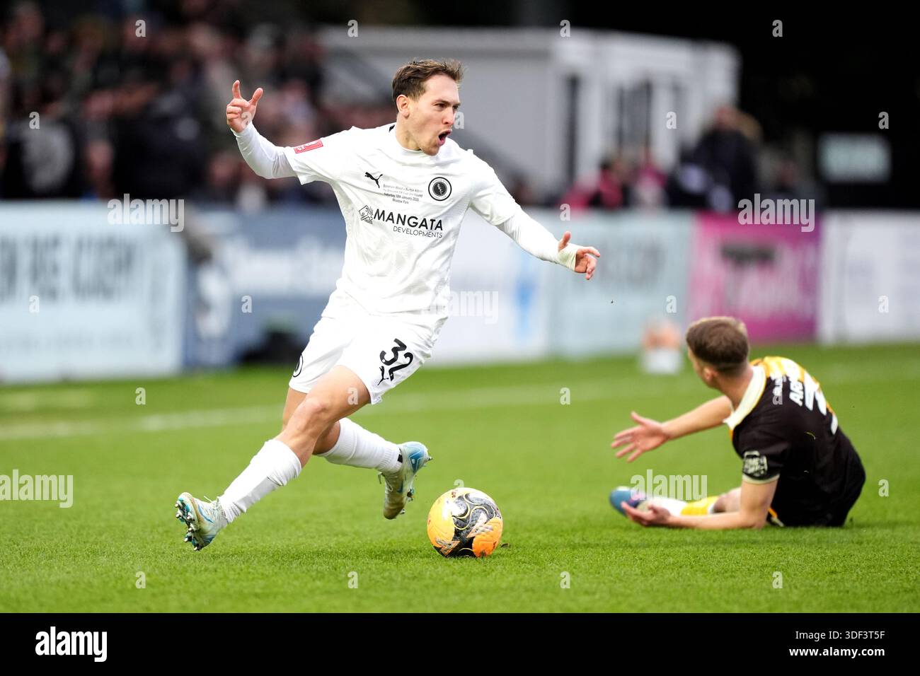 Boreham Wood's Matt Rush (left) reacts after challenging Burton Albion ...