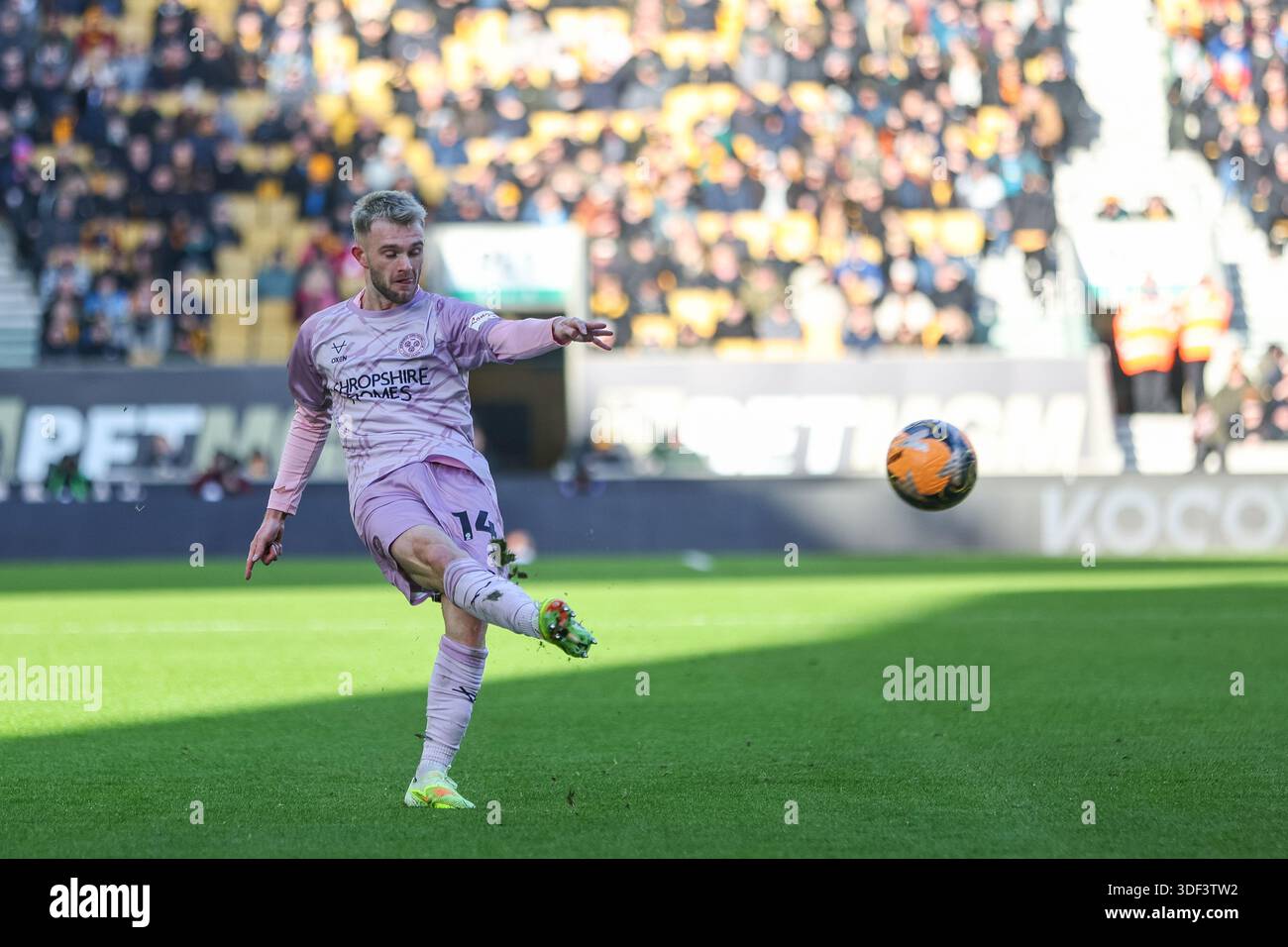14, Taylor Perry of Shrewsbury Town fires the ball in during the ...