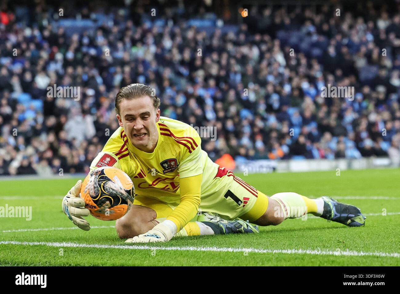 Exeter City goalkeeper Joe Whitworth keeps the ball in play during the ...