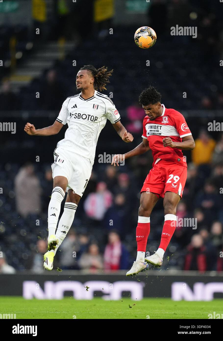 Fulham's Jonah Kusi-Asare and Middlesbrough's Adilson Malanda during ...