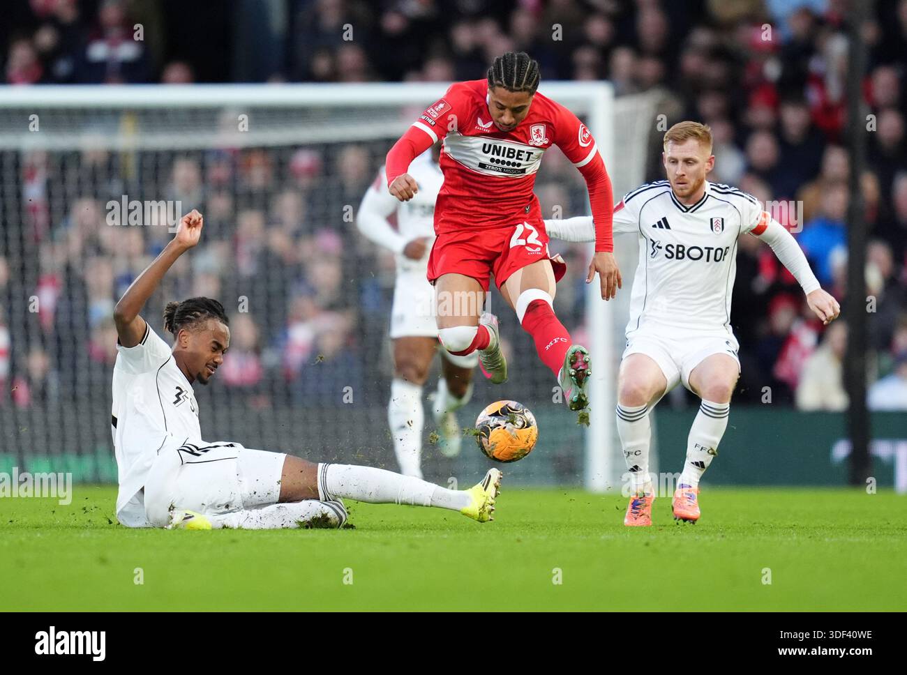 Fulham's Jonah Kusi-Asare (left) tackles Middlesbrough's Samuel Silvera ...