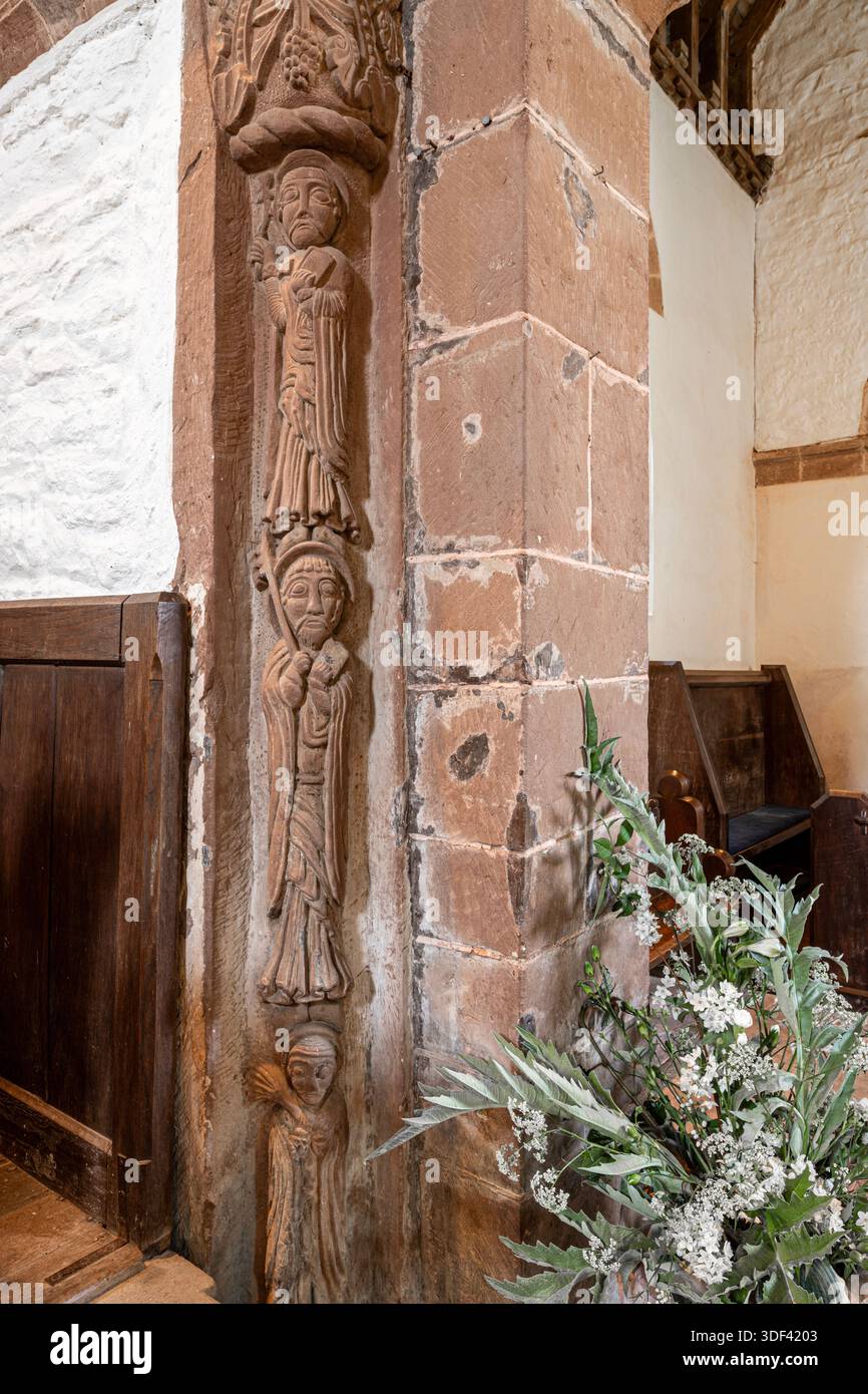 Figures of saints carved in the chancel arch of the Norman Romanesque ...