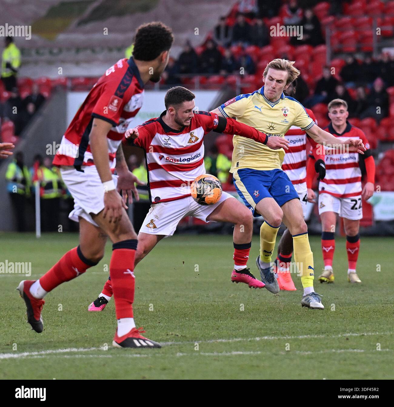 Doncaster Rovers' Luke Molyneux fends off Southampton's Flynn Downesin ...