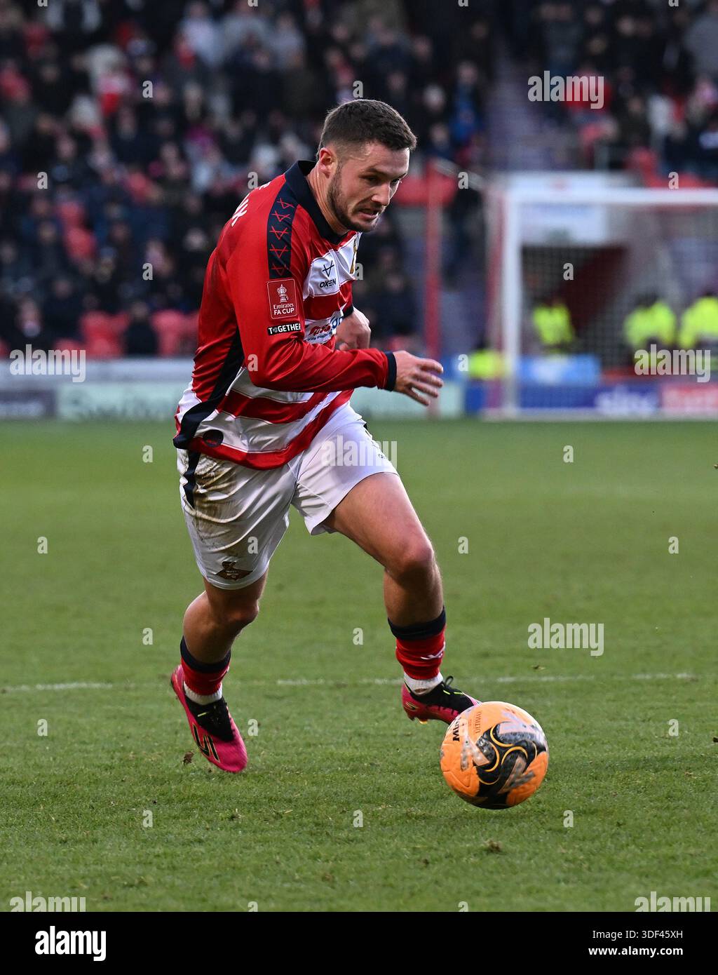 Doncaster Rovers' Luke Molyneux dribbles with the ball in the match ...