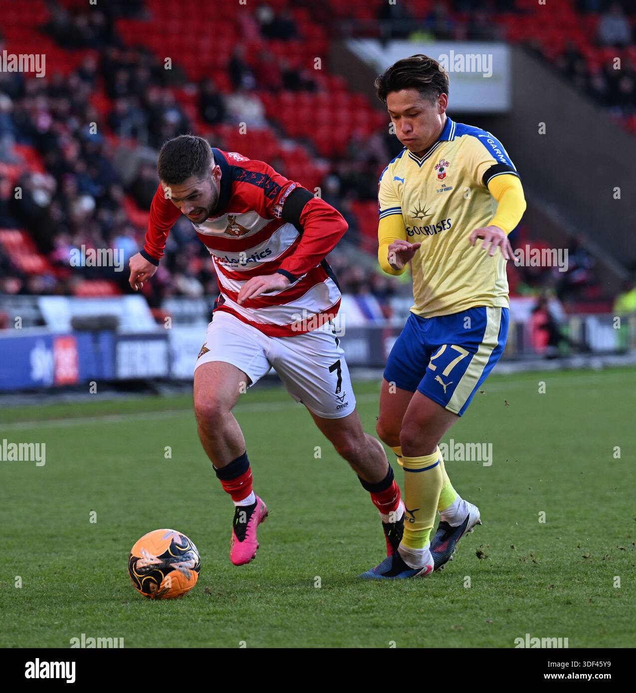 Doncaster Rovers' Luke Molyneux is fouled by Southampton's Kuryu ...