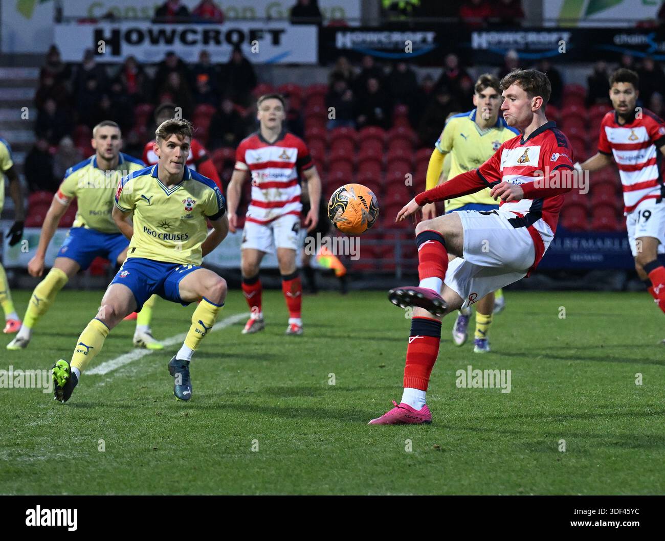 Doncaster Rovers' James Maxwell crosses the ball in the match between ...