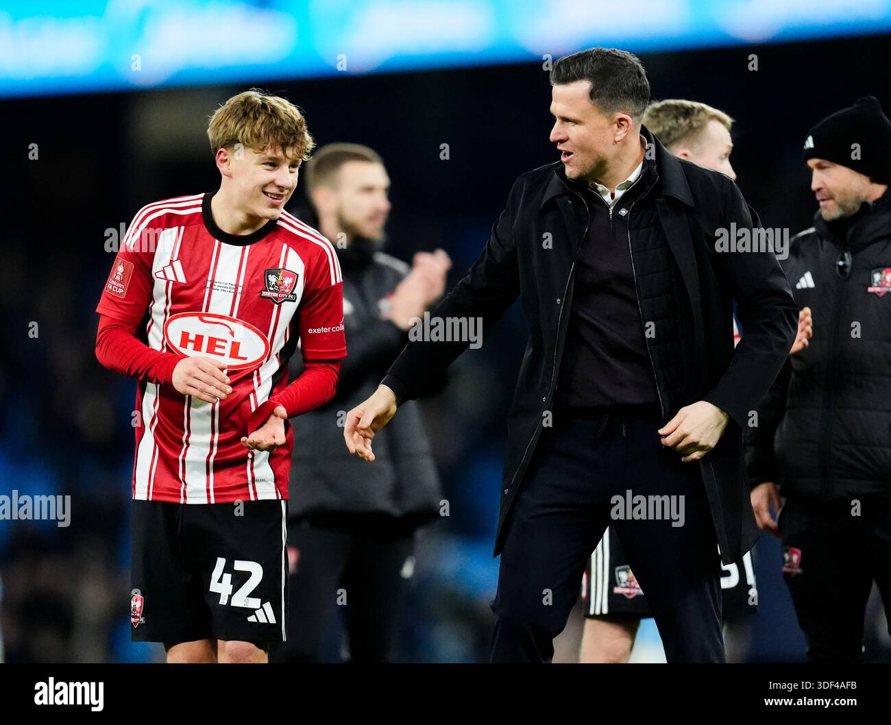 Exeter City's George Birch with manager Gary Caldwell following the ...