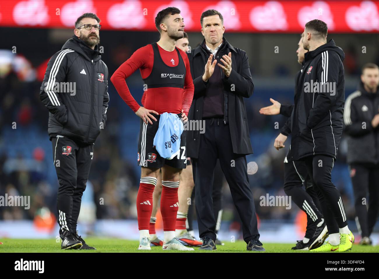 Exeter City midfielder Reece Cole (12) and Exeter City Manager Gary ...