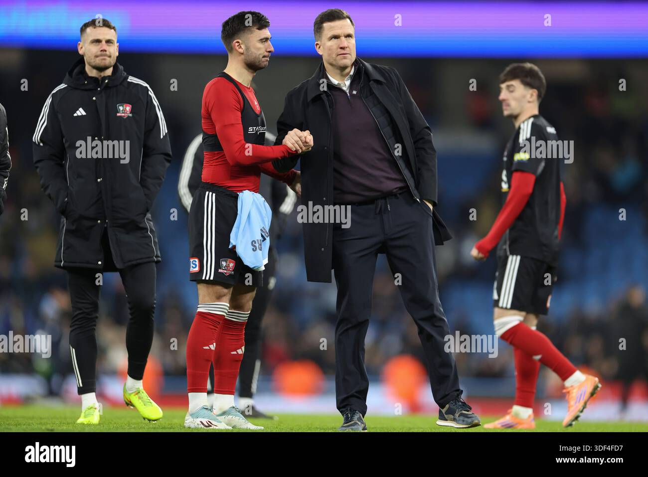 Exeter City midfielder Reece Cole (12) and Exeter City Manager Gary ...