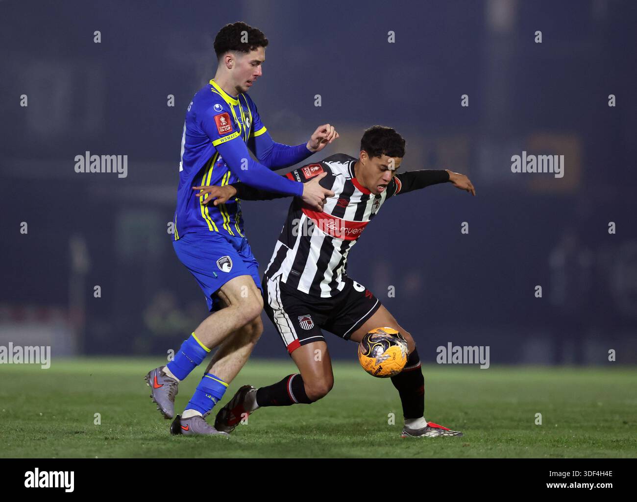 Weston-super-Mare's Charlie Cummins and Grimsby Town's Evan Khouri ...