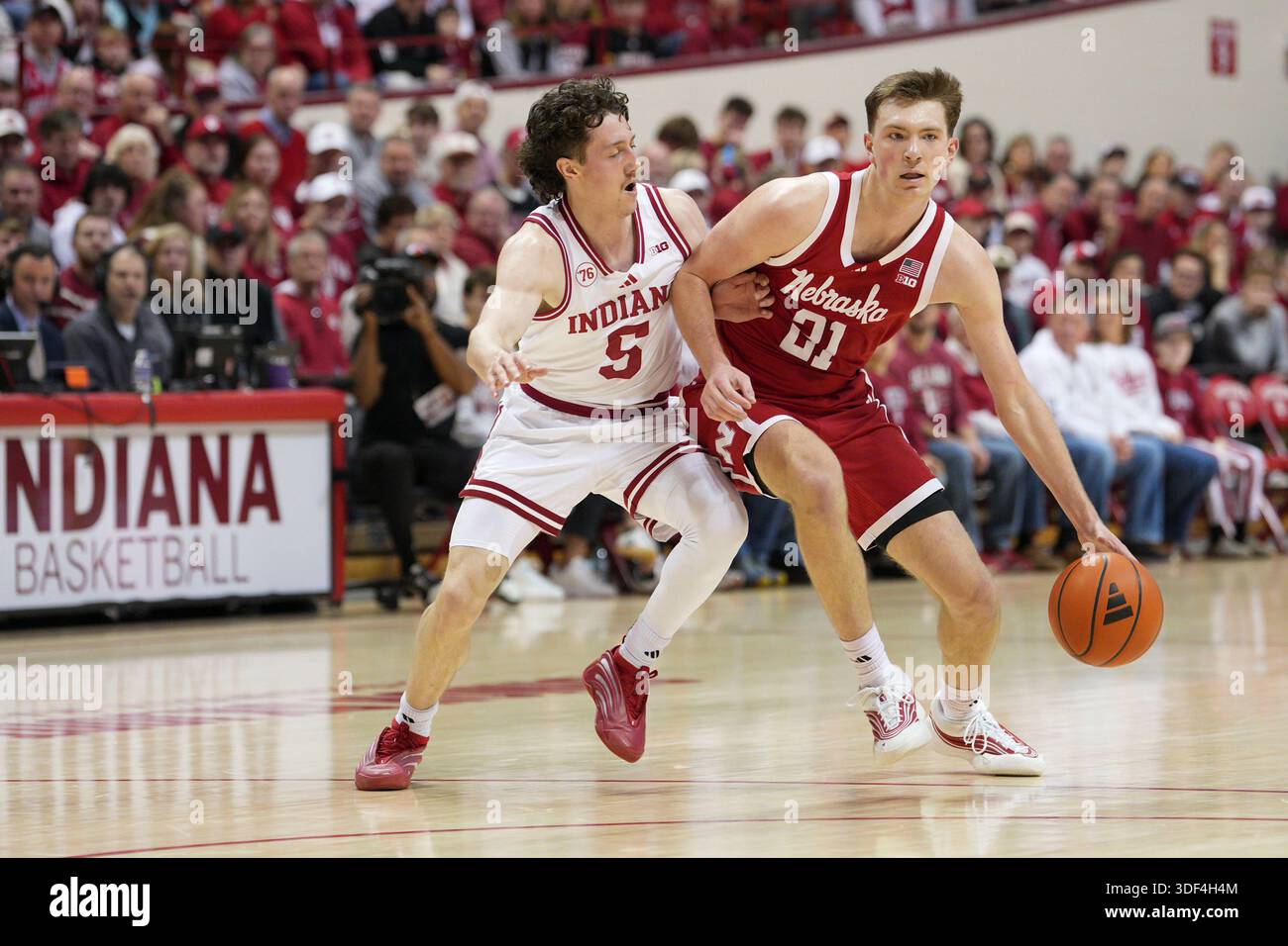 Nebraska forward Pryce Sandfort, right, brings the ball up court agains ...