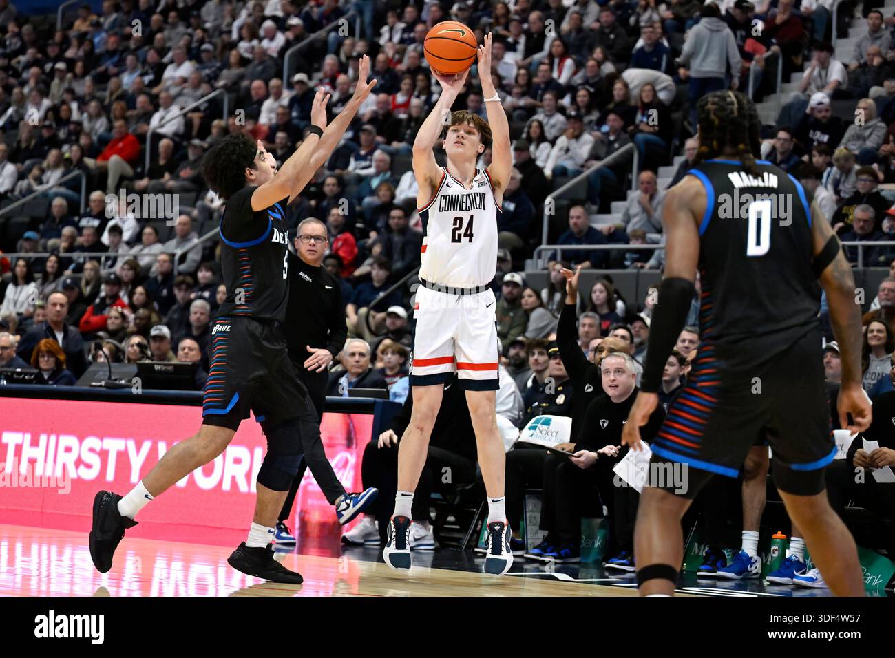 UConn guard Braylon Mullins shoots over DePaul Blue guard RJ Smith ...