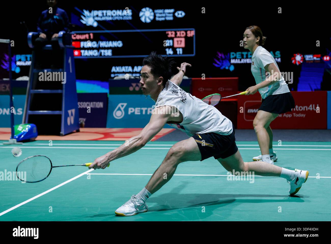 Tang Chun Man (L) and Tse Ying Suet of Hong Kong play against Feng Yan ...