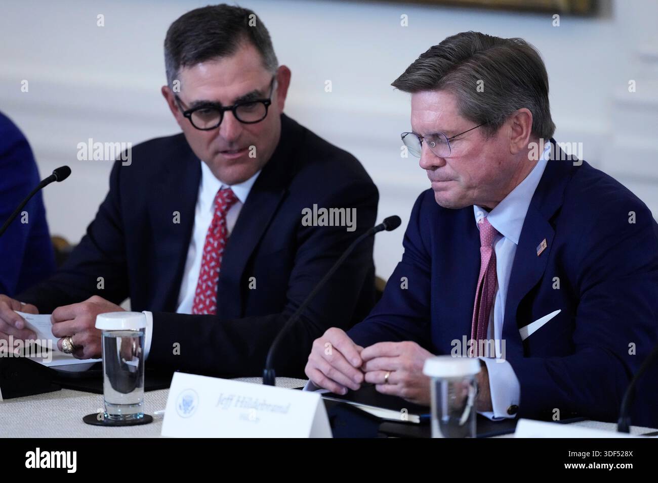 Jeff Miller, president and CEO of Halliburton, left, speaks as Jeff ...